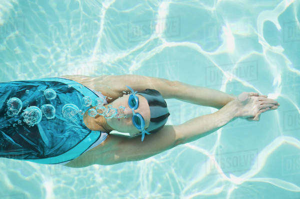 Woman swimming on her back - Royalty-free Stock Photo | Dissolve