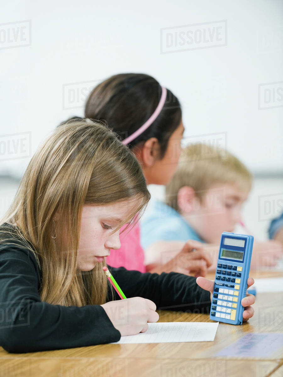 Students doing math work in classroom - Royalty-free Stock Photo | Dissolve