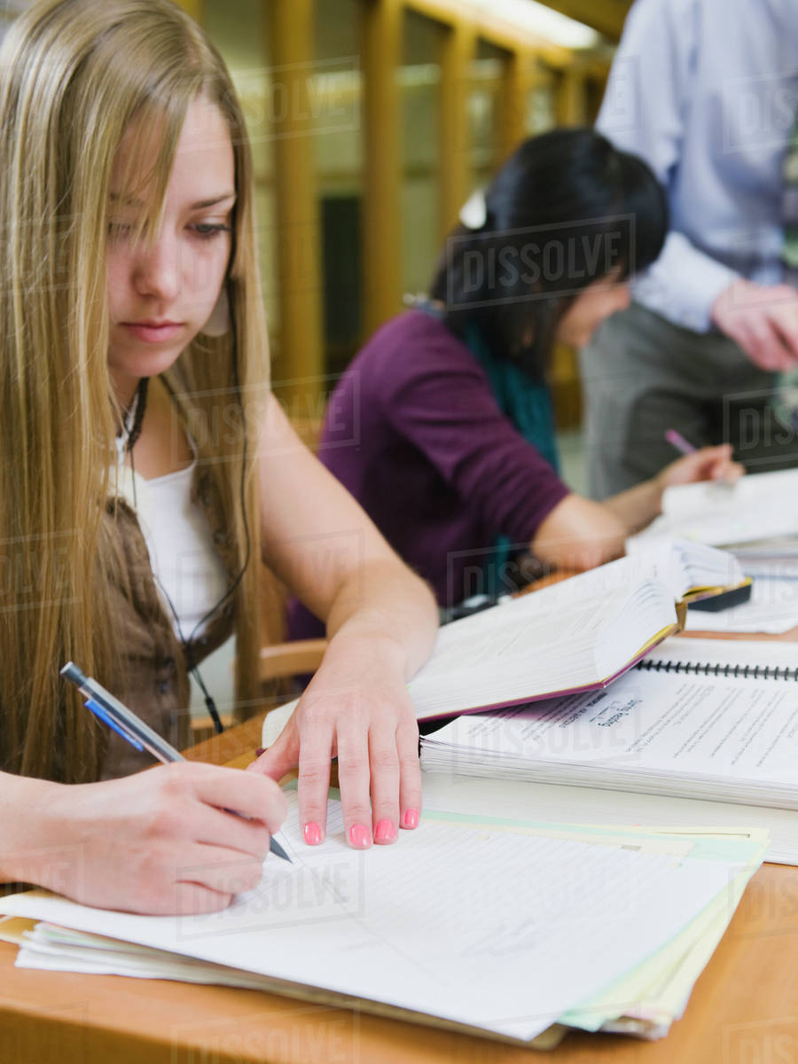 College students working in library - Royalty-free Stock Photo | Dissolve