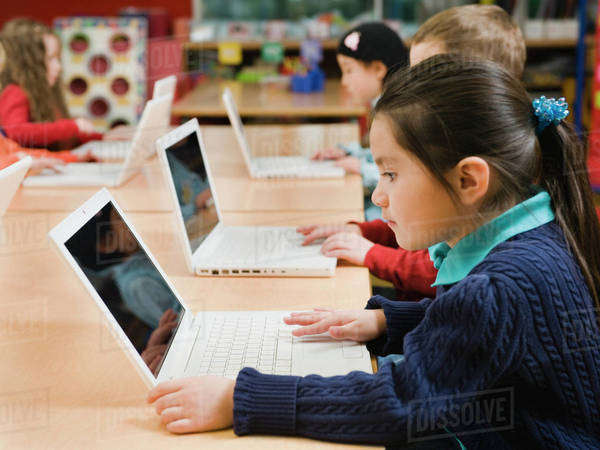 Kindergarten students working on laptops - Royalty-free Stock Photo ...