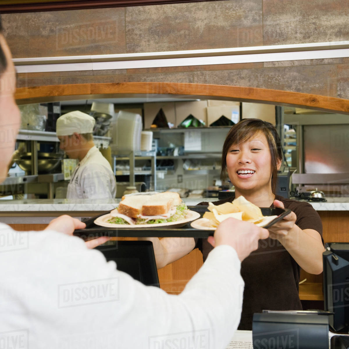 Customer receiving tray of food in bakery - Royalty-free Stock Photo ...