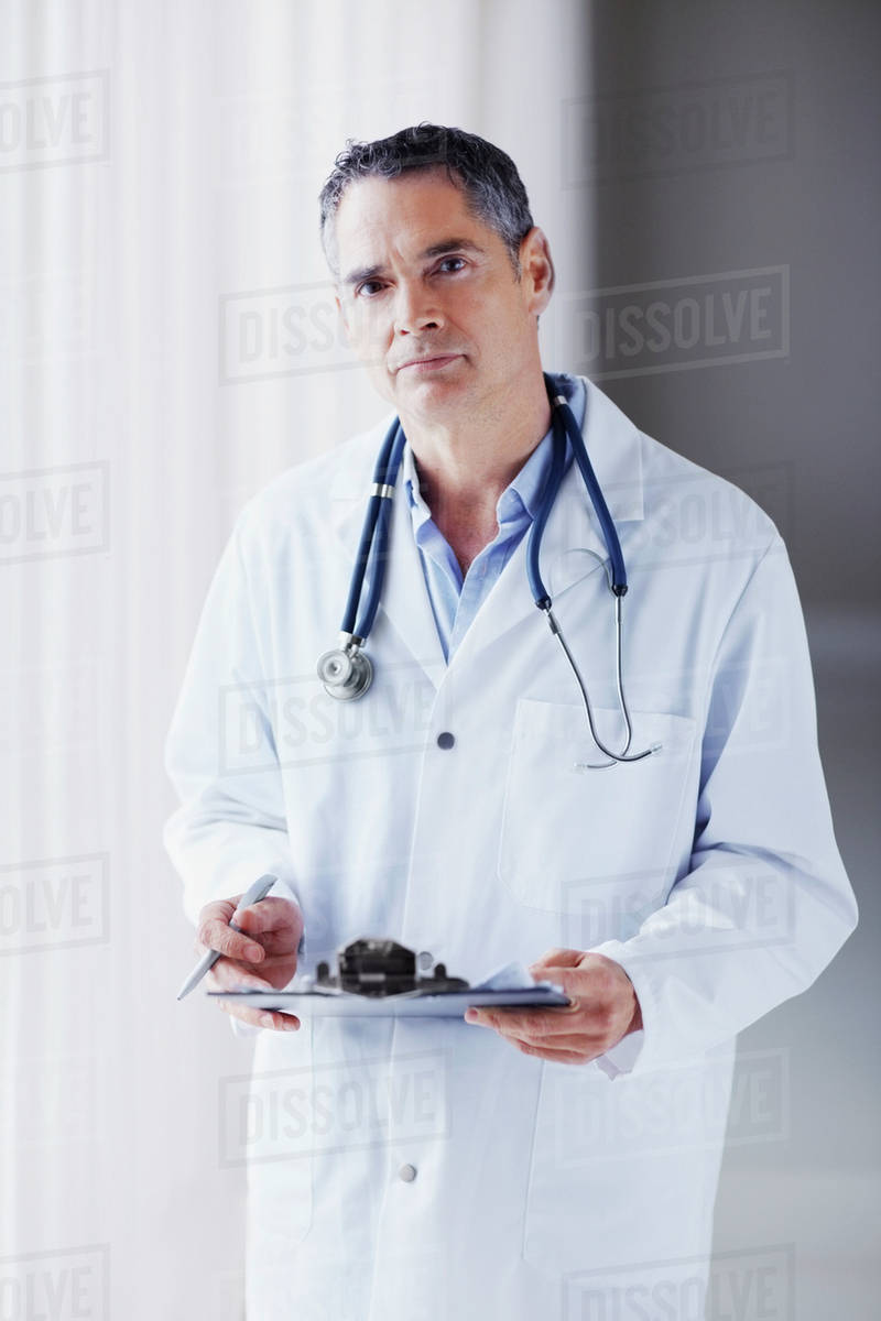 Doctor holding chart - Royalty-free Stock Photo | Dissolve