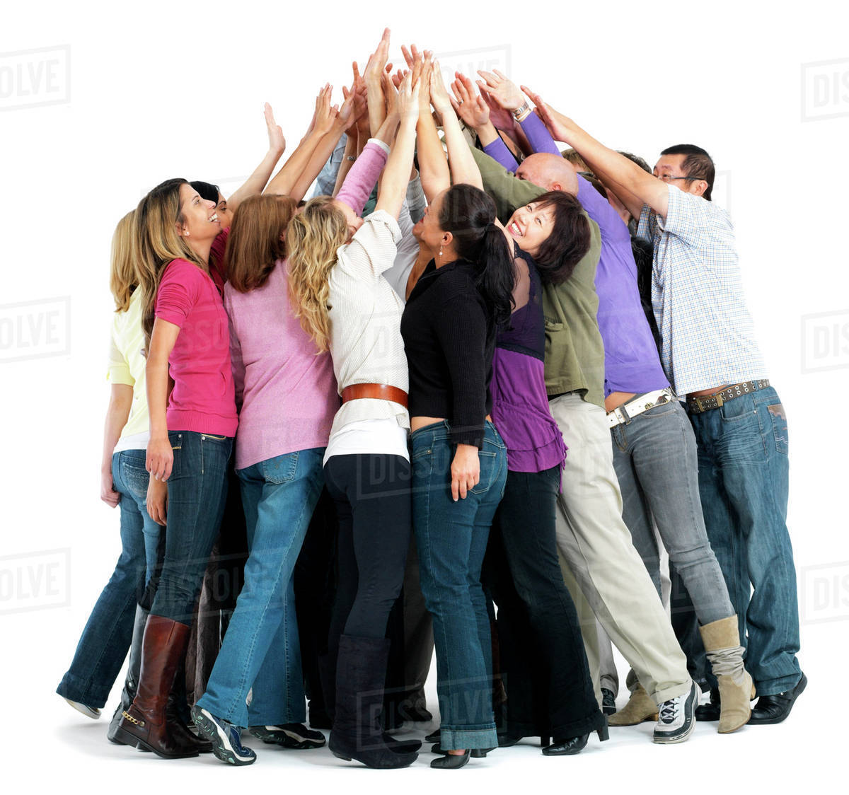 Group of friends huddled together - Stock Photo - Dissolve