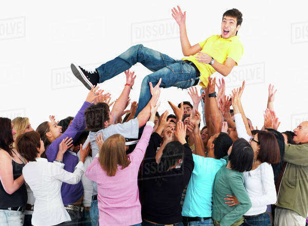 Group of people carrying man - Royalty-free Stock Photo | Dissolve