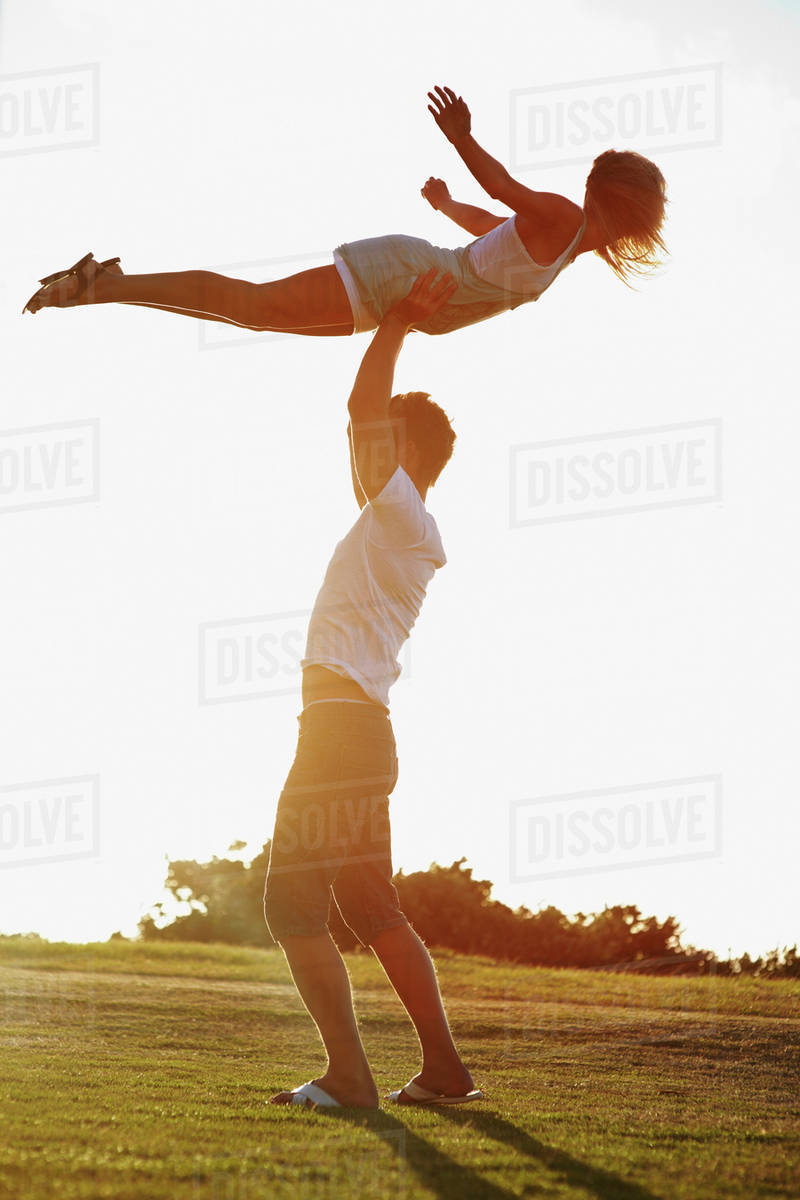 Man lifting girlfriend - Royalty-free Stock Photo | Dissolve