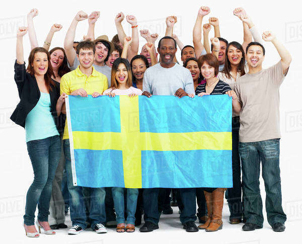 Group of people holding flag - Royalty-free Stock Photo | Dissolve