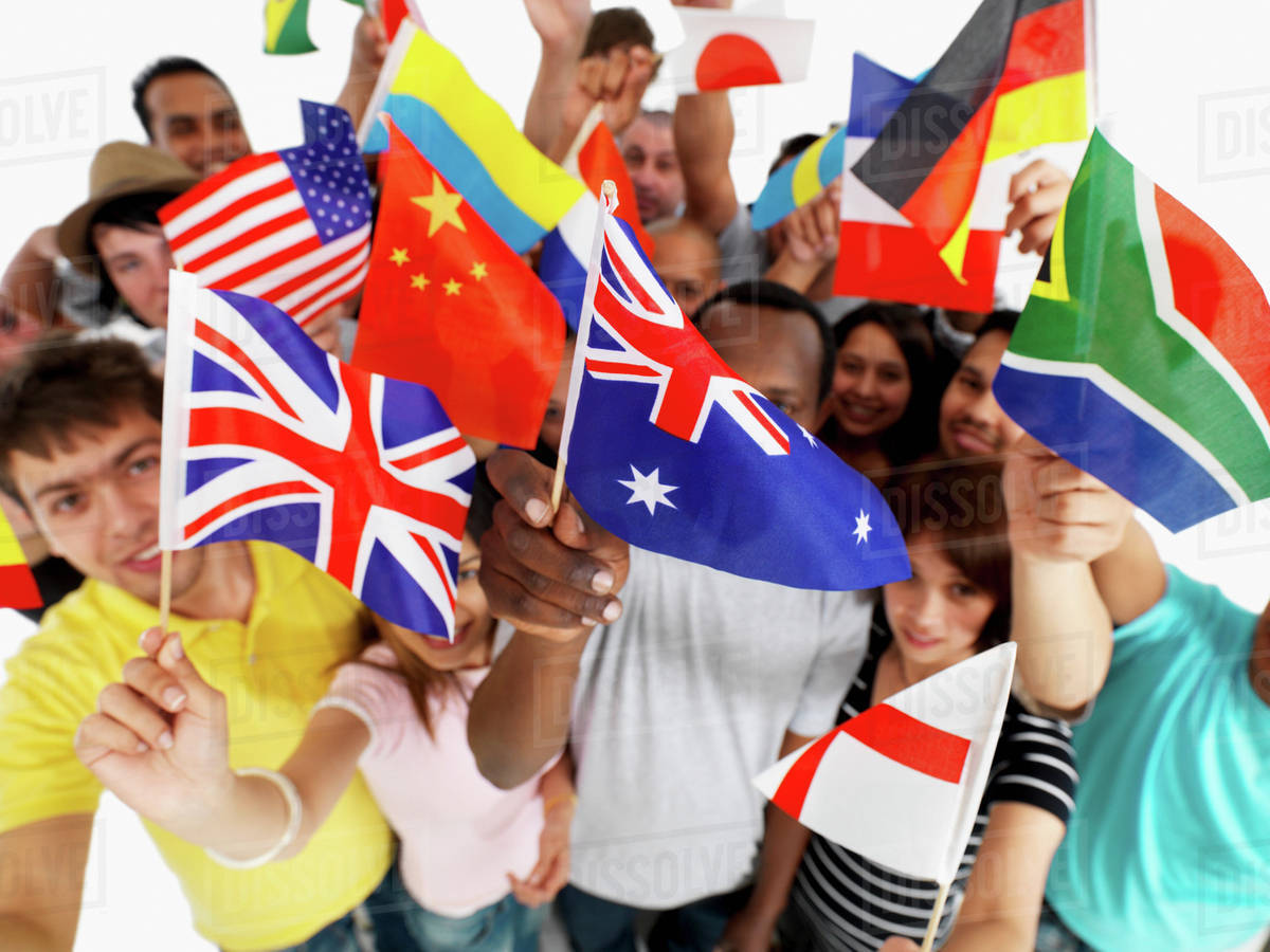 Group of people holding flags - Stock Photo - Dissolve