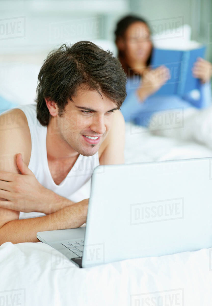 Man browsing the internet - Royalty-free Stock Photo | Dissolve