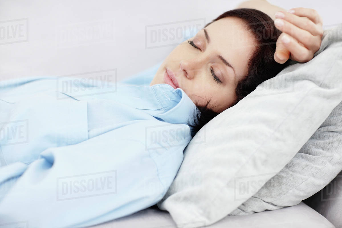 Brunette woman resting - Royalty-free Stock Photo | Dissolve