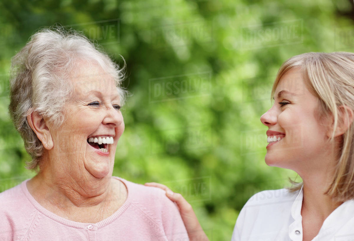 Two women laughing - Royalty-free Stock Photo | Dissolve