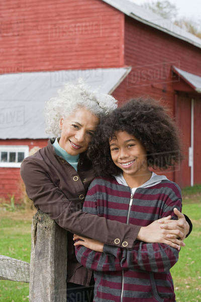 Woman embracing child - Stock Photo - Dissolve