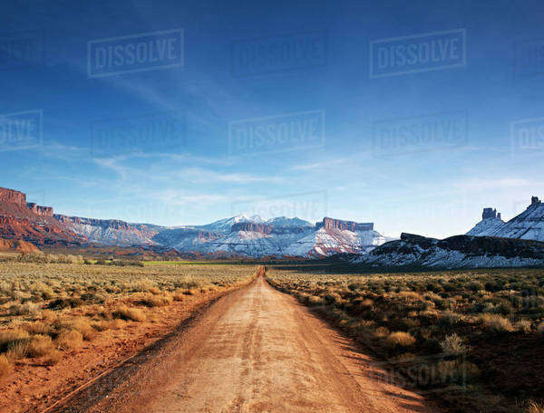 Desolate road through the desert - Royalty-free Stock Photo | Dissolve