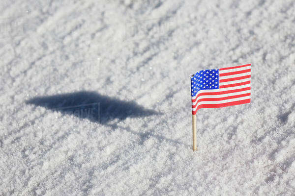 American flag in the snow - Royalty-free Stock Photo | Dissolve