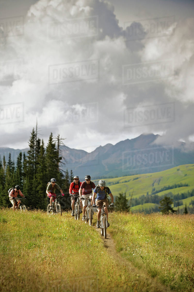Men mountain biking on trail - Royalty-free Stock Photo | Dissolve