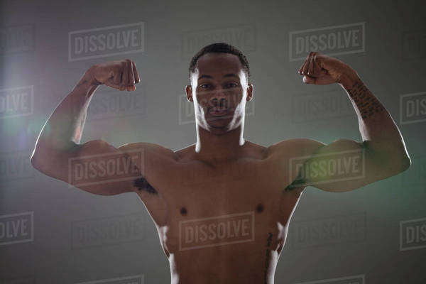 Physically fit man flexing his triceps - Royalty-free Stock Photo ...