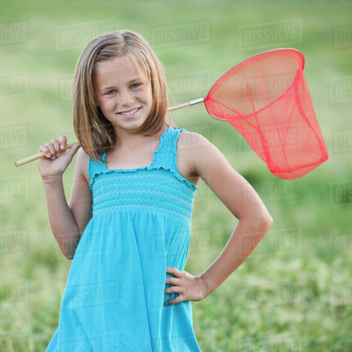 Young girl holding a butterfly net - Royalty-free Stock Photo | Dissolve