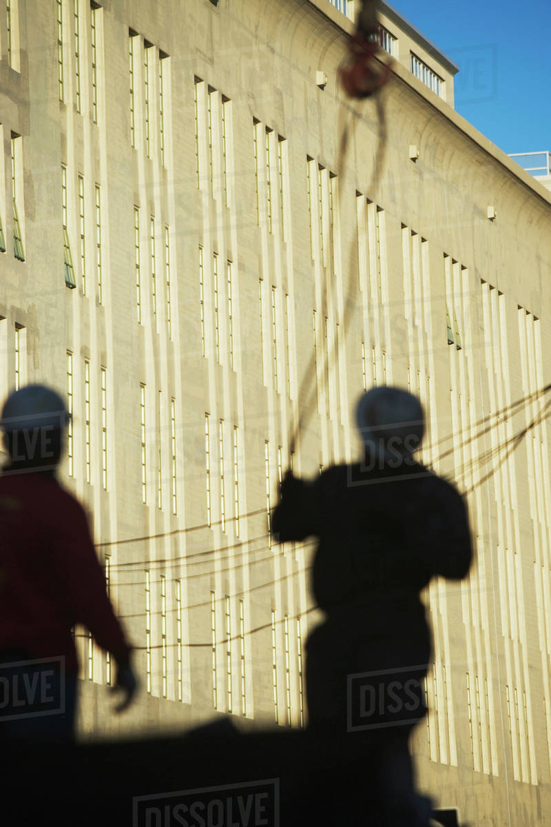 Shadows of construction workers on wall - Royalty-free Stock Photo ...