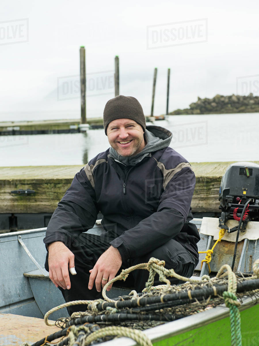 Portrait of man in boat - Royalty-free Stock Photo | Dissolve