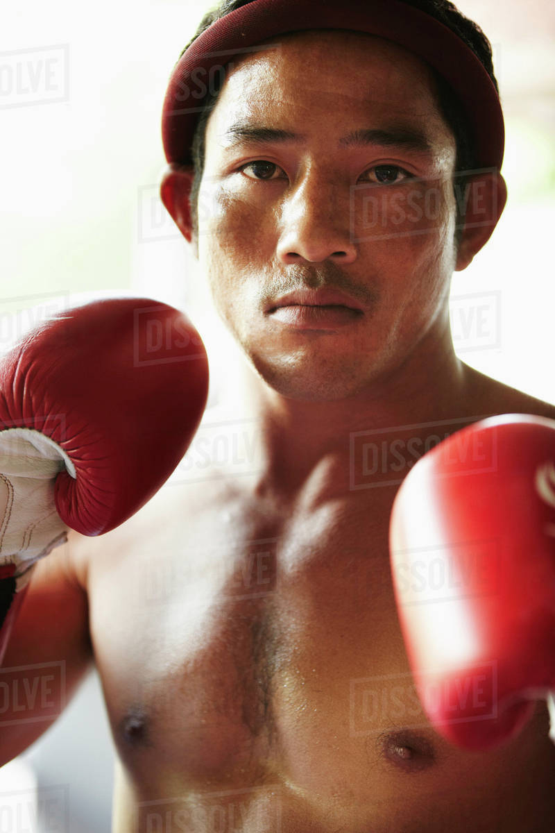 Portrait of mid adult male boxer in fighting stance - Royalty-free ...