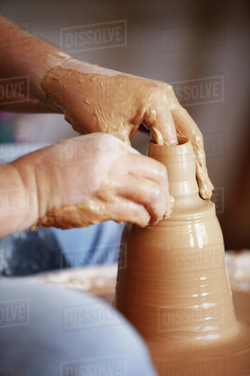 Hands working with clay on potter's wheel - Royalty-free Stock Photo ...