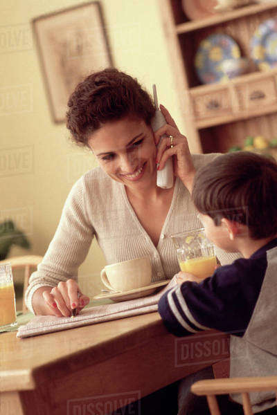 Multi tasking mother - Stock Photo - Dissolve