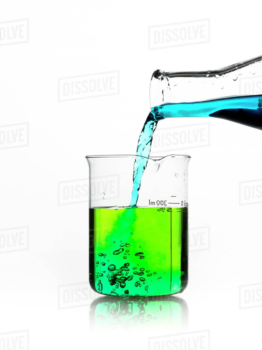 Blue liquid being poured into measuring cup - Royalty-free Stock Photo ...