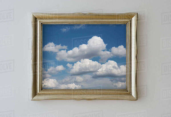 Framed picture of cloudy sky - Stock Photo - Dissolve