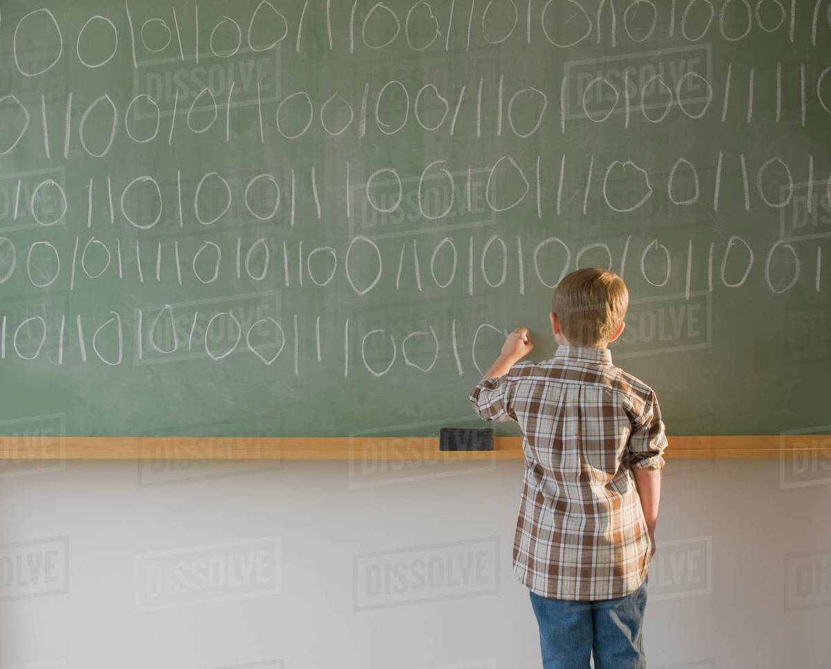 Boy writing binary code on blackboard - Royalty-free Stock Photo | Dissolve