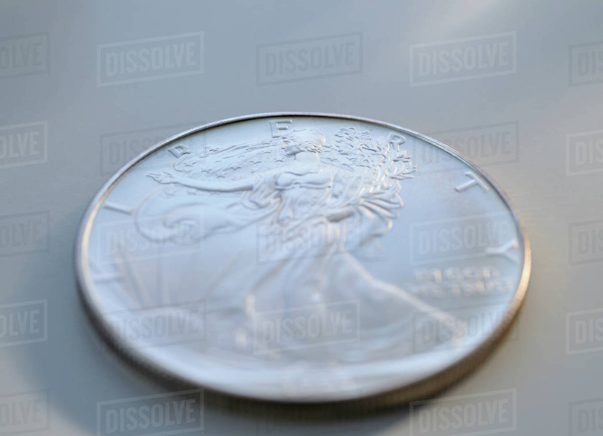 Close up of silver coin - Royalty-free Stock Photo | Dissolve