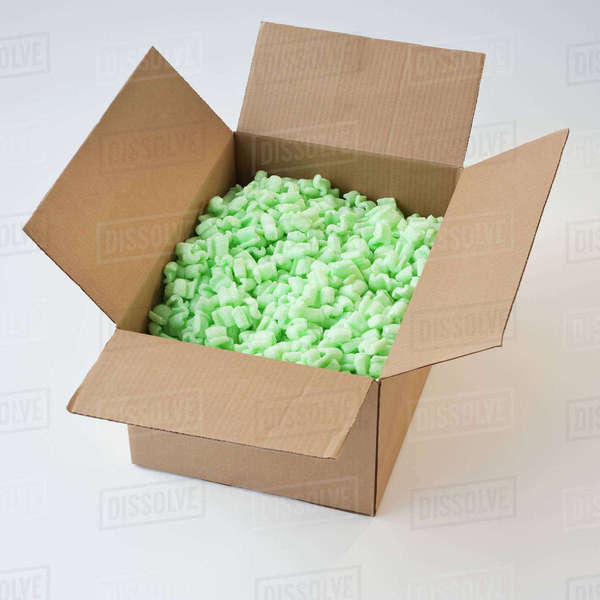 Packing peanuts in cardboard box - Royalty-free Stock Photo | Dissolve