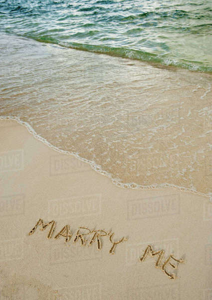 Marry me message written in sand - Royalty-free Stock Photo | Dissolve