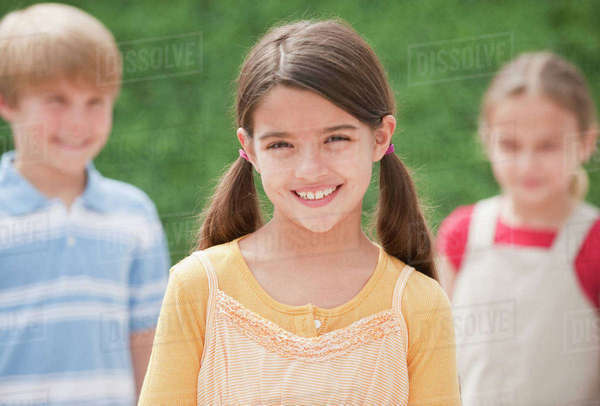 Three children outdoors - Royalty-free Stock Photo | Dissolve