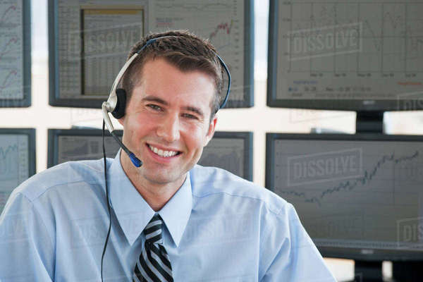 Male trader with headset - Royalty-free Stock Photo | Dissolve
