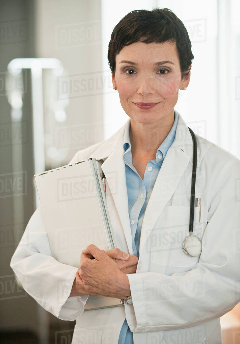 Doctor holding chart - Royalty-free Stock Photo | Dissolve