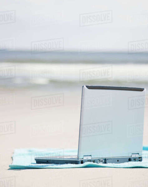 Laptop on beach - Royalty-free Stock Photo | Dissolve