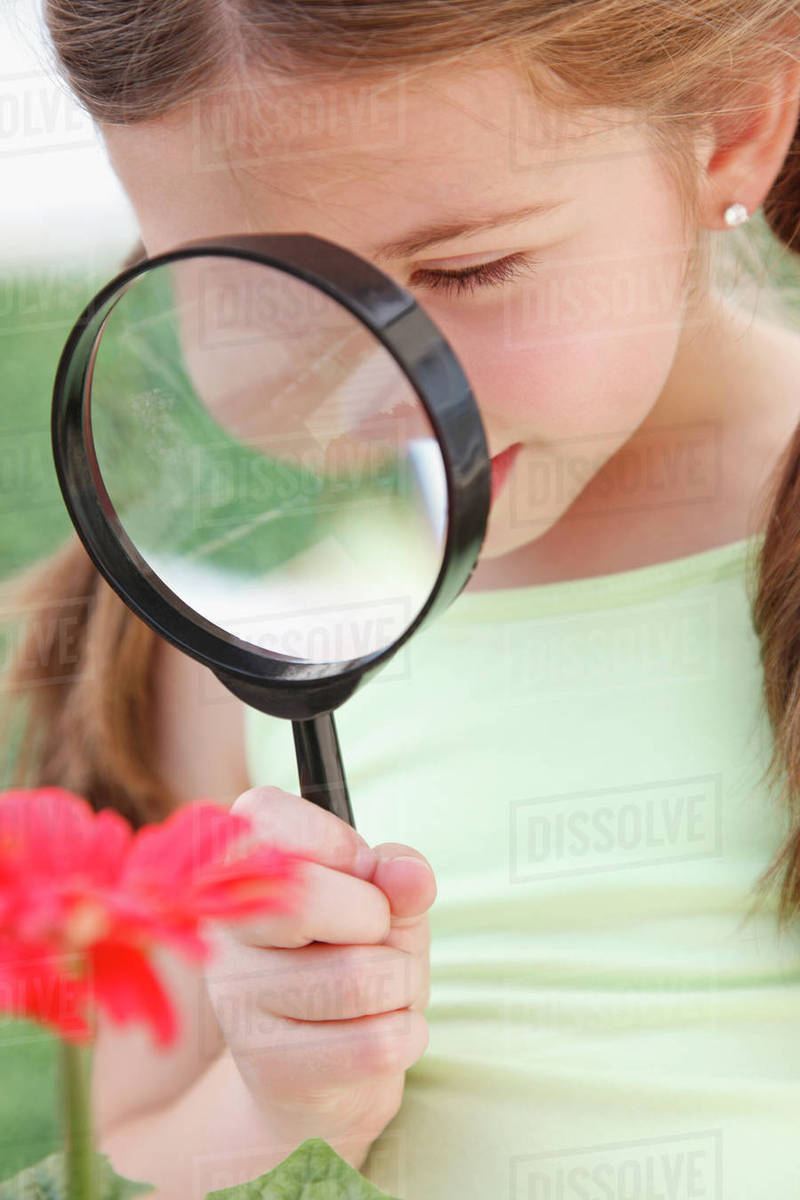 Child looking through magnifying glass - Royalty-free Stock Photo ...
