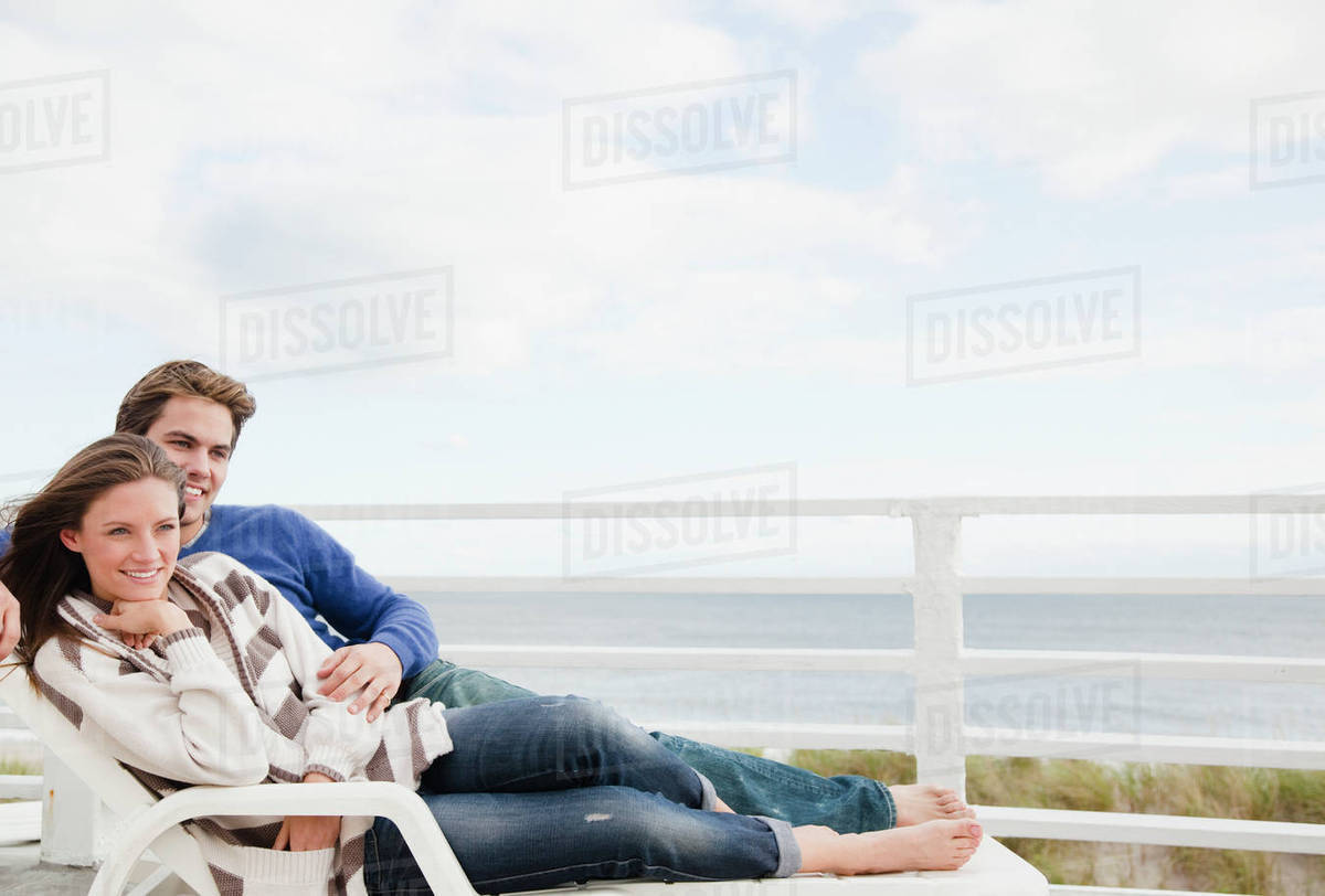 Couple on lounge chair - Royalty-free Stock Photo | Dissolve