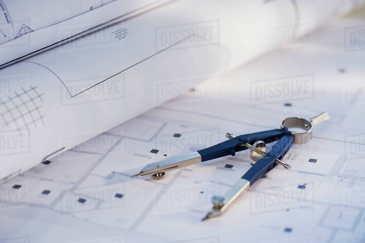 Drawing compass and blueprints - Royalty-free Stock Photo | Dissolve