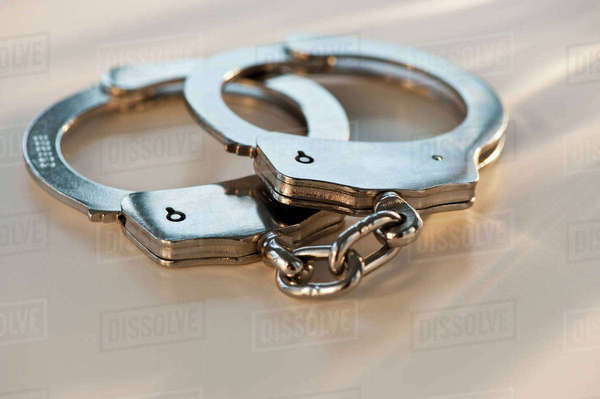 Hand cuffs - Royalty-free Stock Photo | Dissolve