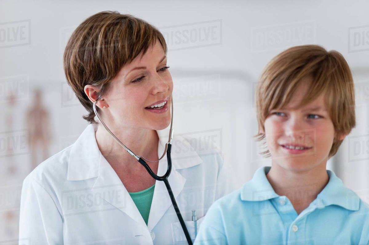Female doctor with child - Royalty-free Stock Photo | Dissolve