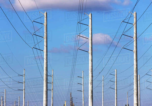 Communication tower and power lines - Royalty-free Stock Photo | Dissolve