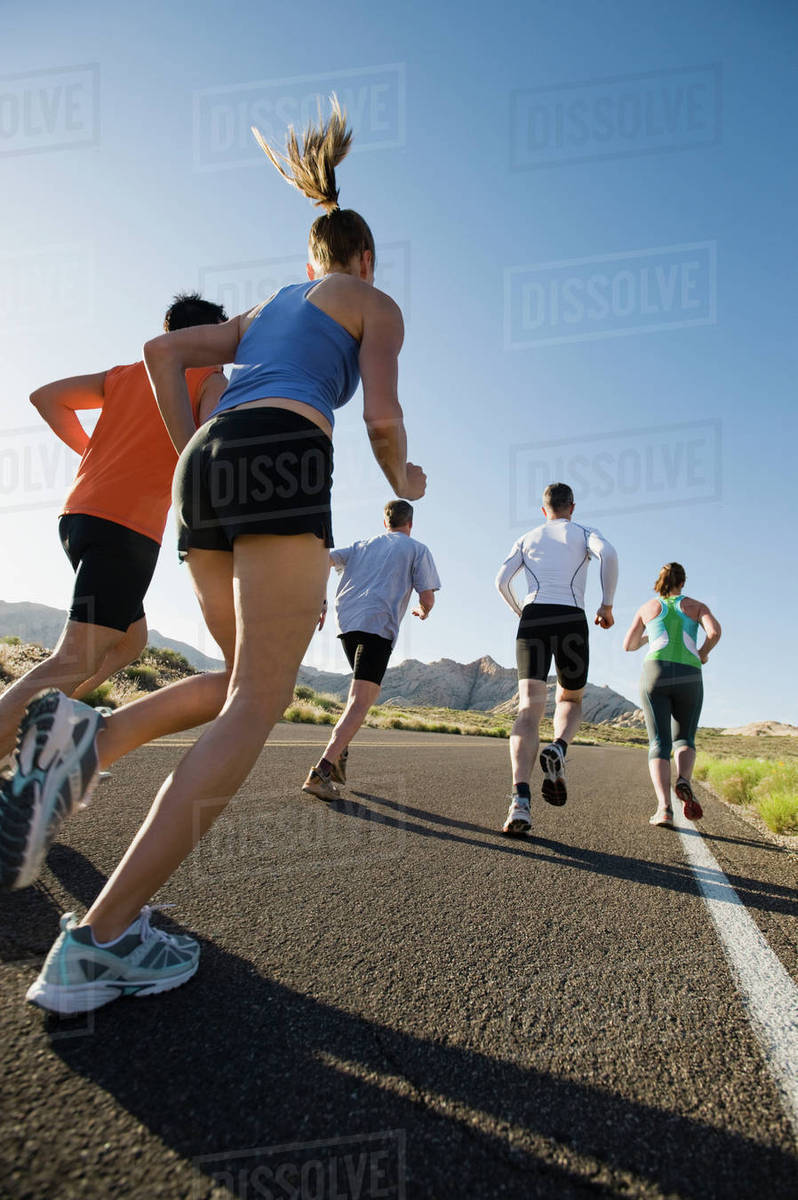 Runners on a road - Royalty-free Stock Photo | Dissolve