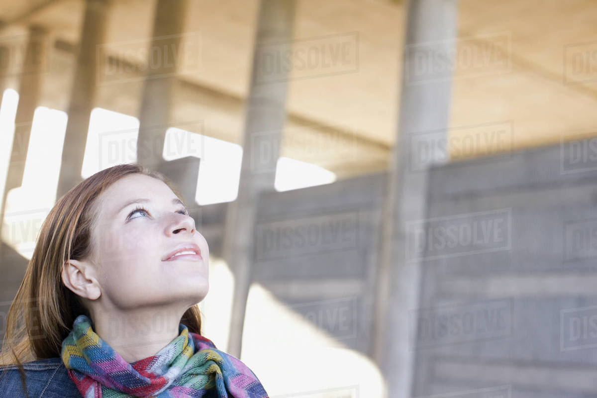 Young woman looking up - Royalty-free Stock Photo | Dissolve