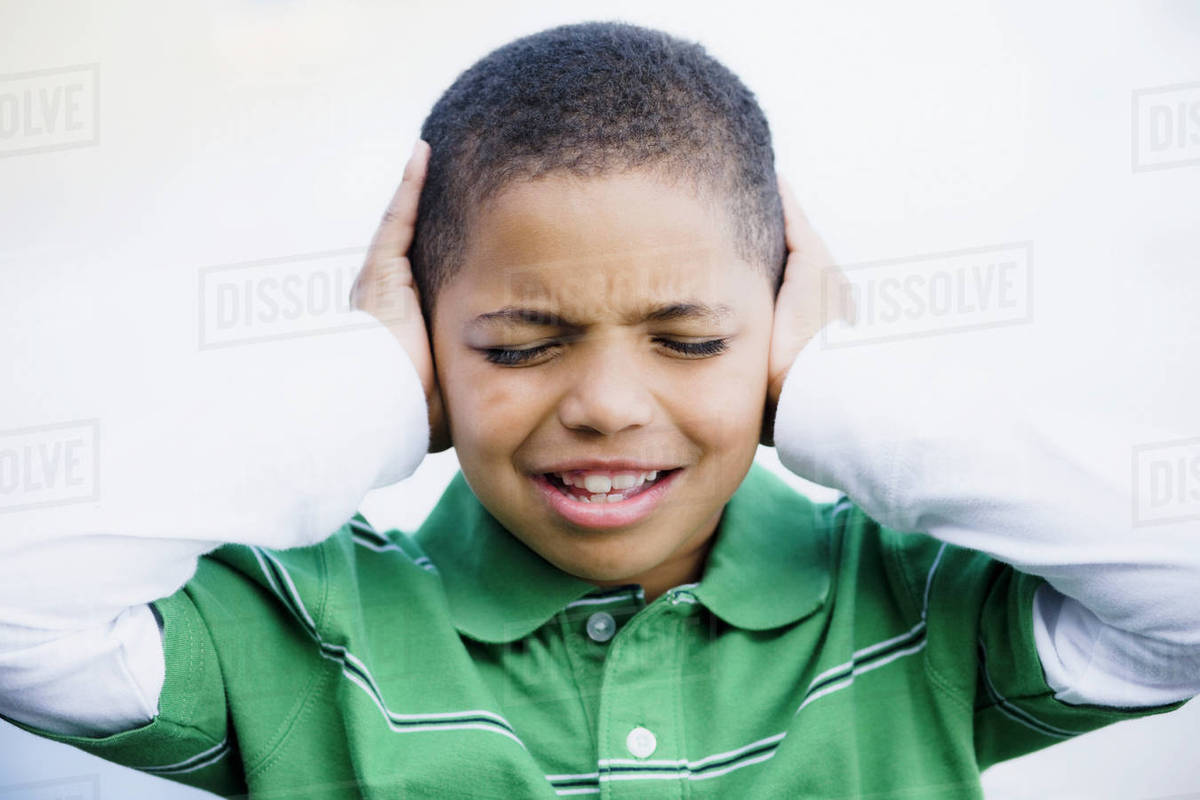 Boy with hands over ears - Royalty-free Stock Photo | Dissolve