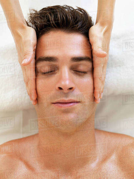 Man receiving massage in spa - Royalty-free Stock Photo | Dissolve
