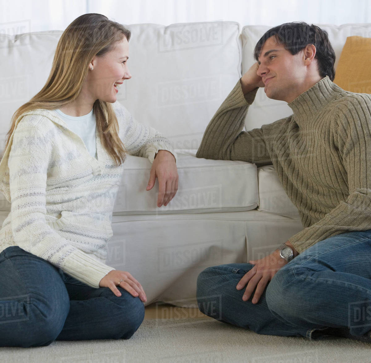 Couple sitting on floor talking - Royalty-free Stock Photo | Dissolve
