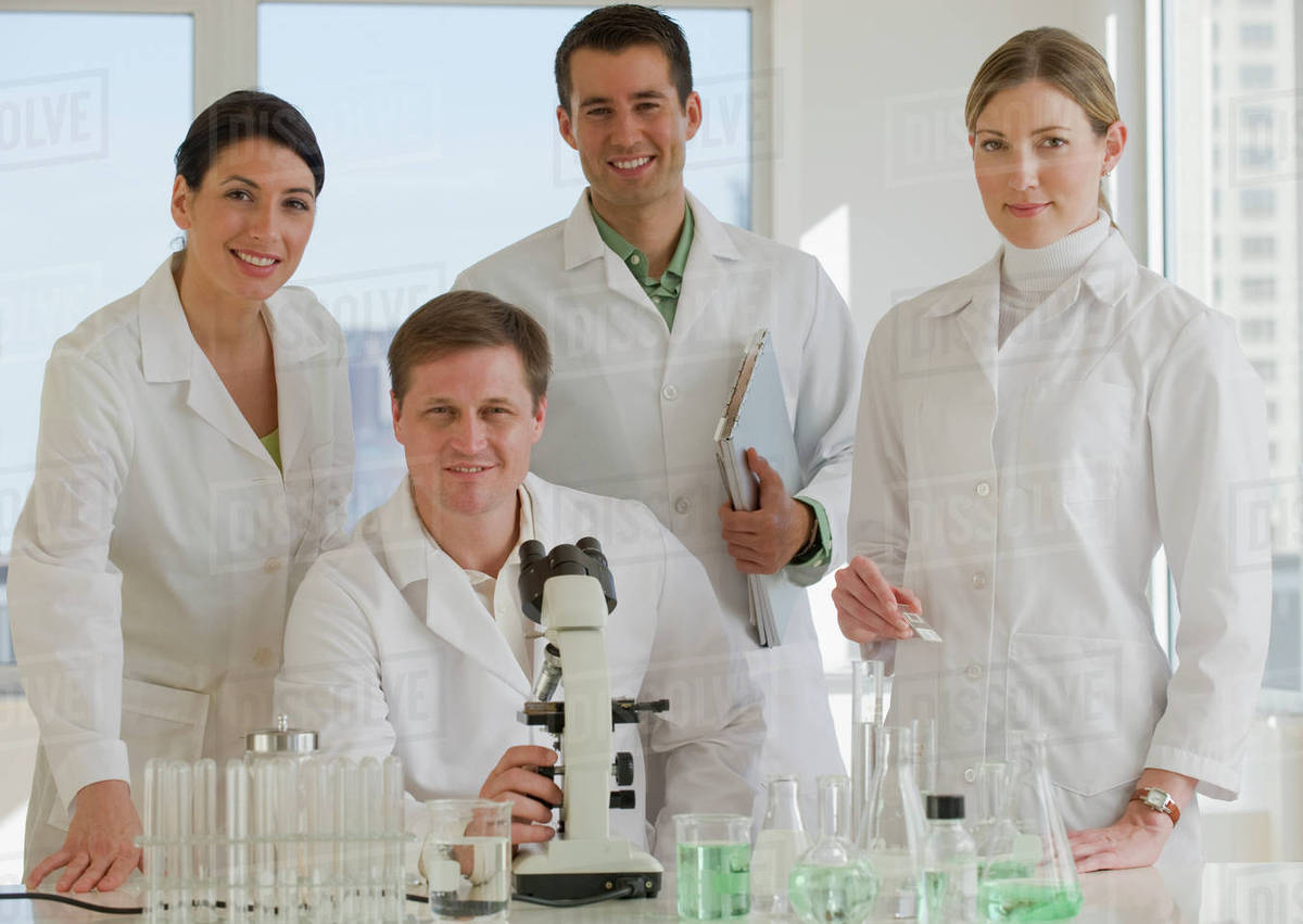 Scientists Posing In Pharmaceutical Laboratory Stock Photo Dissolve scientists-posing-in-pharmaceutical-laboratory-stock-photo-dissolve