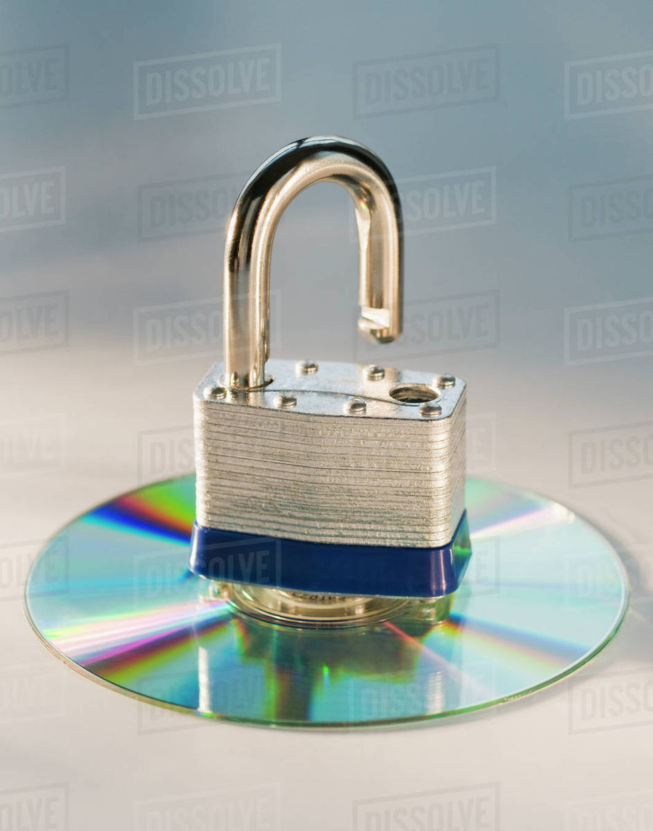 Lock and compact disc - Stock Photo - Dissolve