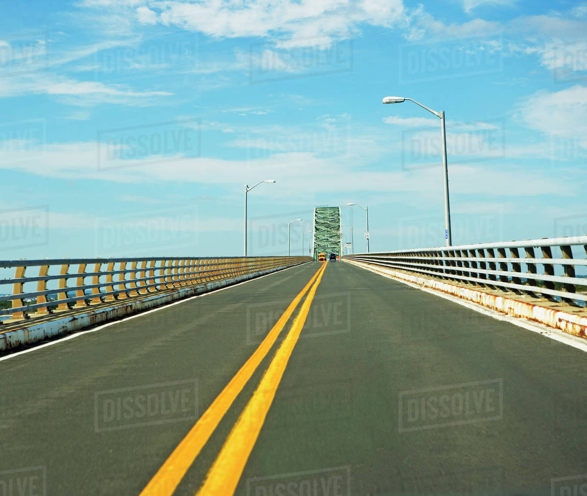 Road with bridge in distance - Royalty-free Stock Photo | Dissolve