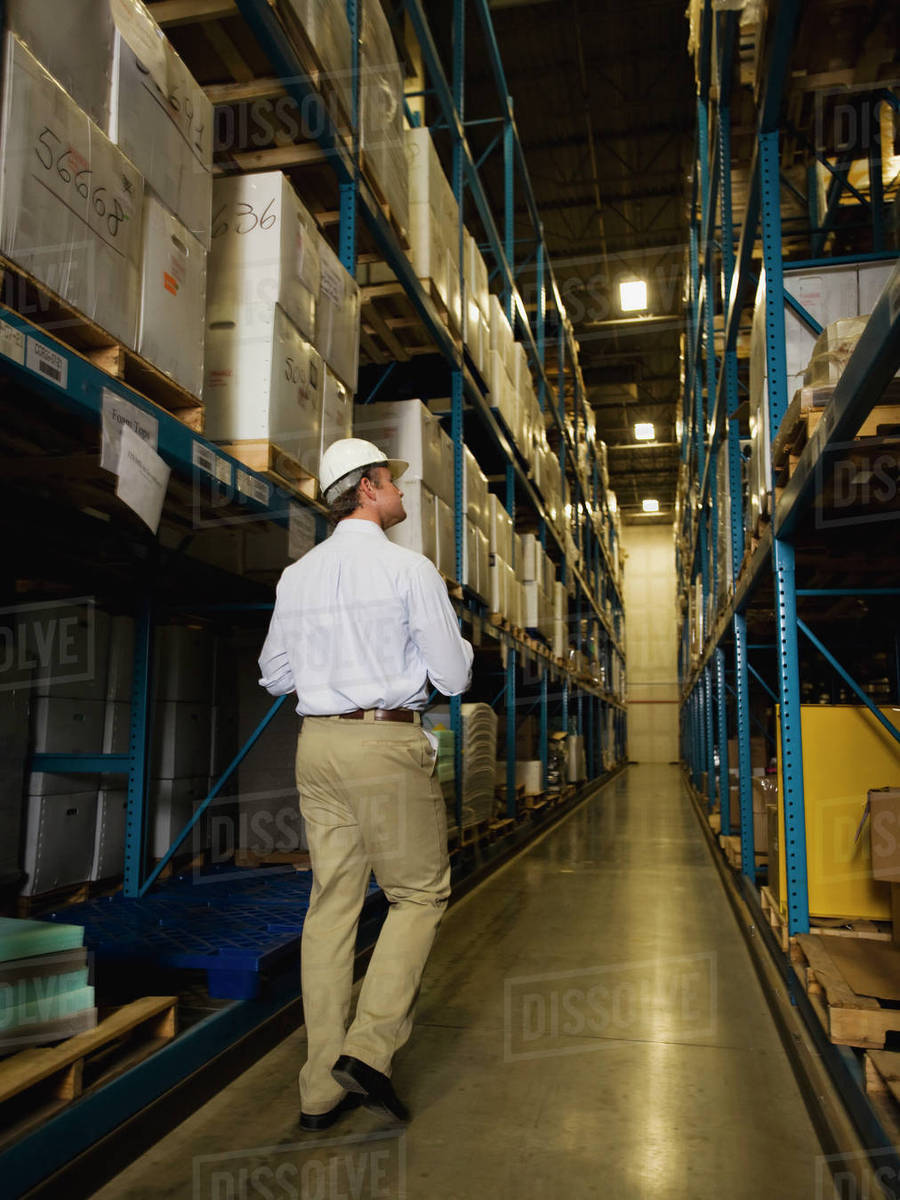 Warehouse worker checking inventory - Royalty-free Stock Photo | Dissolve